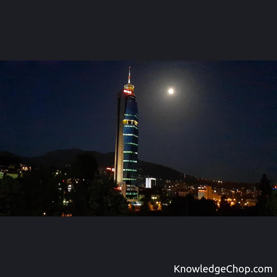 Sarajevo at night. Moon above Avaz Twist Tower | 🥷 Knowledge Ninja